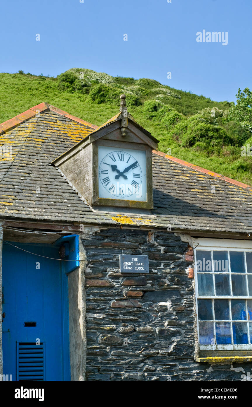 The clock in the harbour at Port Isaac in Cornwall, England Stock Photo ...