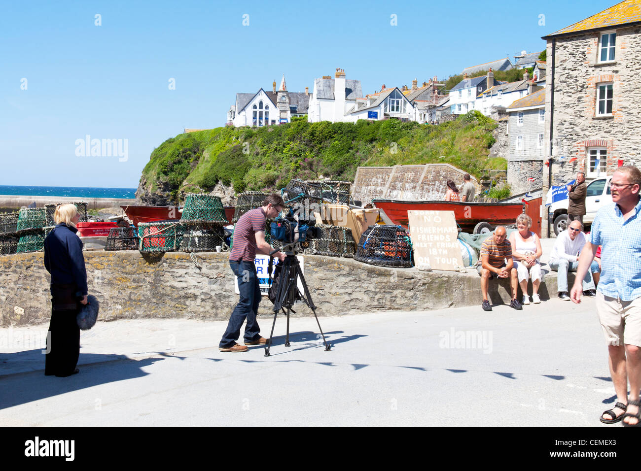 Port Isaac in Cornwall England, camera man filming episode of Doc ...