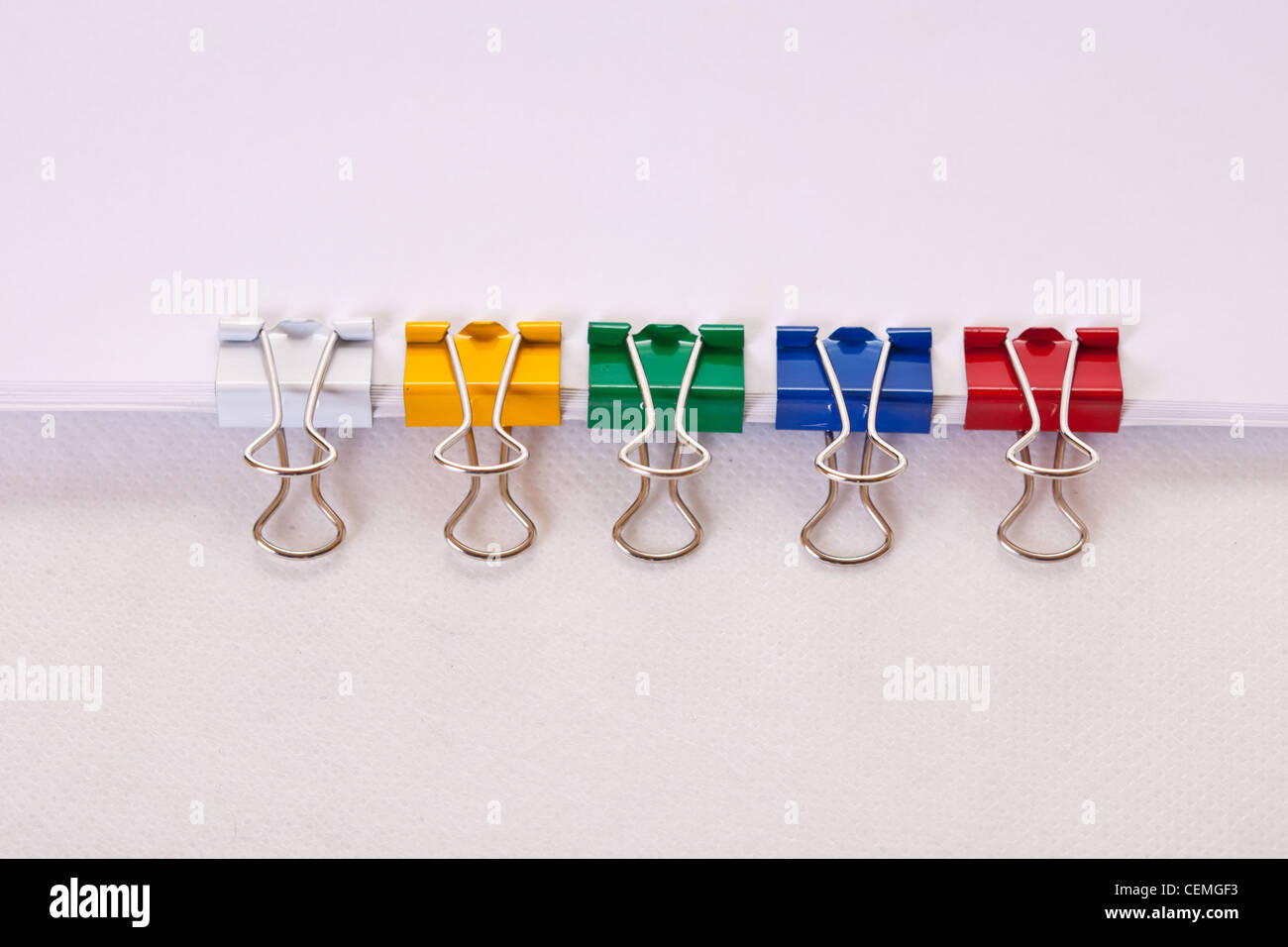 bulldog clips,paper clips,multi coloured paper clips Stock Photo - Alamy