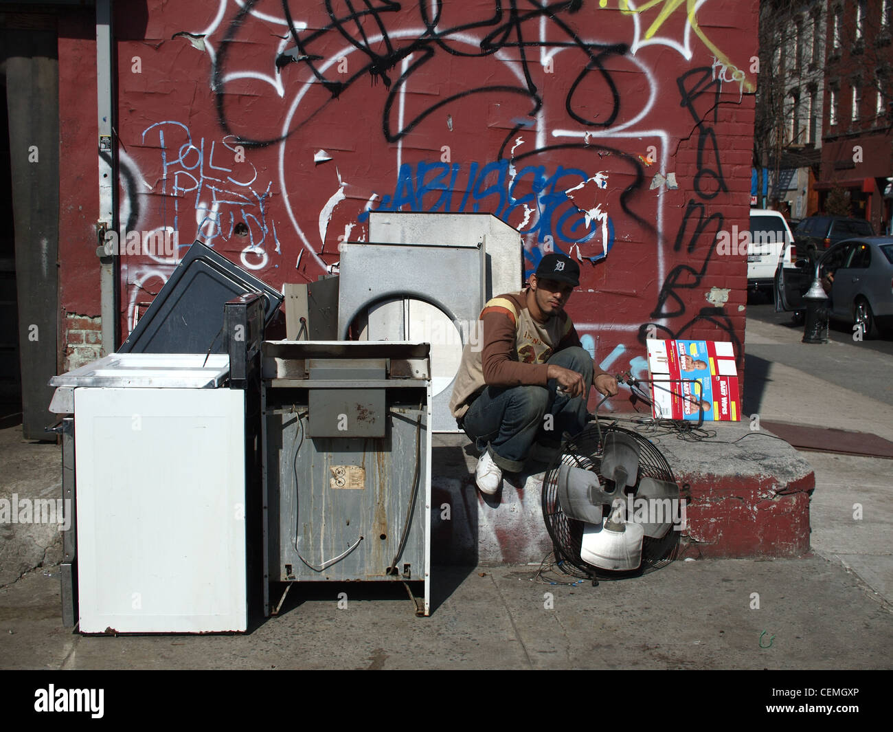 Man repairing refrigerators on street, Brooklyn, New York Stock Photo ...