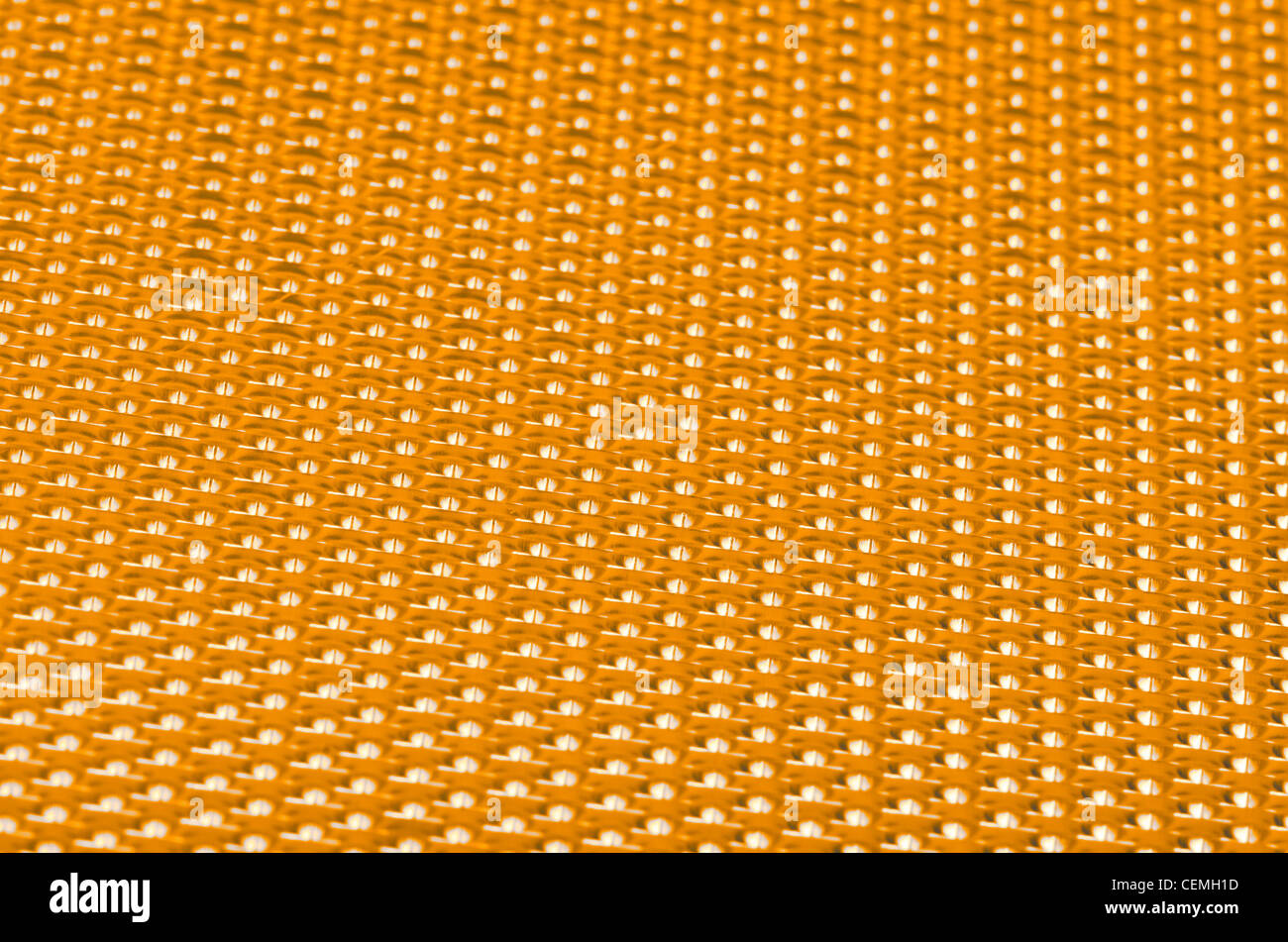 Yellow metal mesh plating isolated against a white background Stock ...