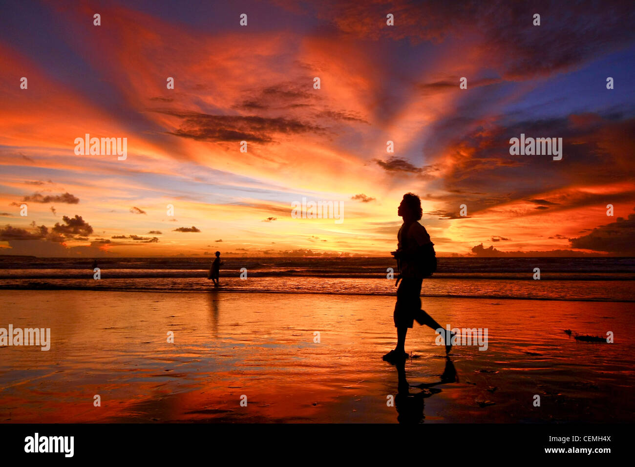 walking on sunset beach Bali Indonesia Stock Photo - Alamy