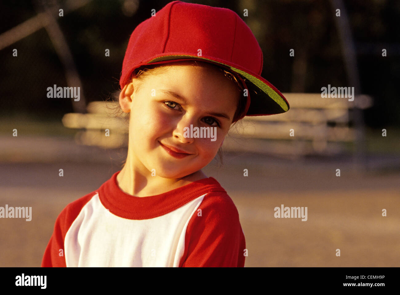Young girl Little League Baseball player sunset light portrait Stock ...