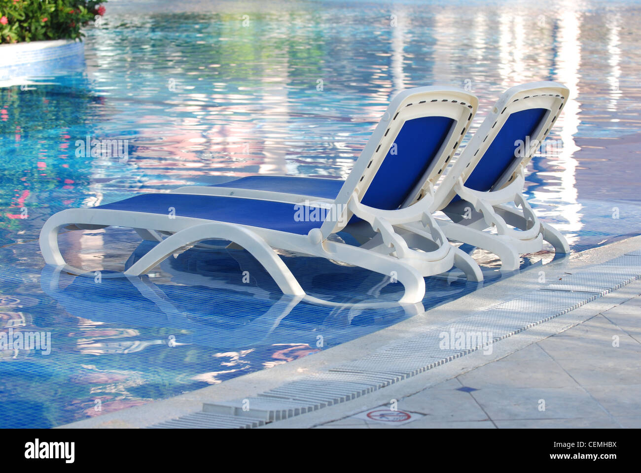 Pool with chairs Stock Photo - Alamy
