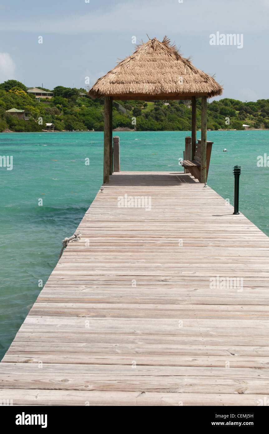 tropical wooden jetty with hut over sea in Long Bay, Antigua Stock ...