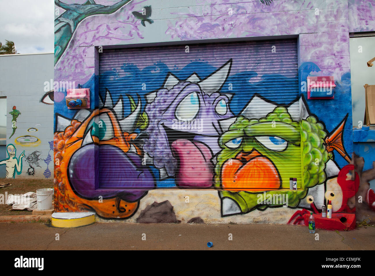 Contemporary street art, three colorful fish cartoons on wall Stock ...