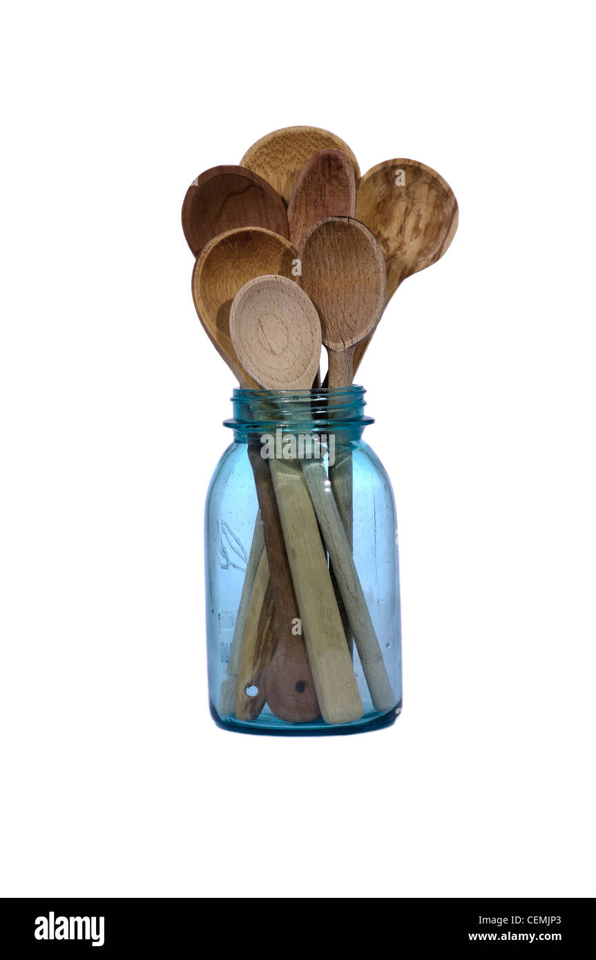 Wooden spoons in a blue canning jar - isolated on white Stock Photo - Alamy