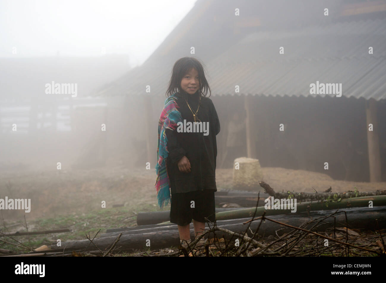 Hmong child standing in the mountain mist, Sapa Vietnam Stock Photo - Alamy
