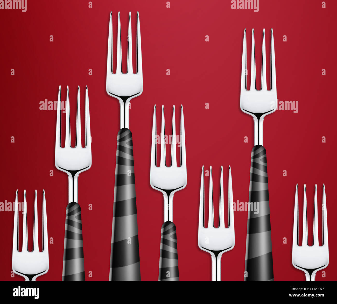 Set of forks on red background Stock Photo - Alamy