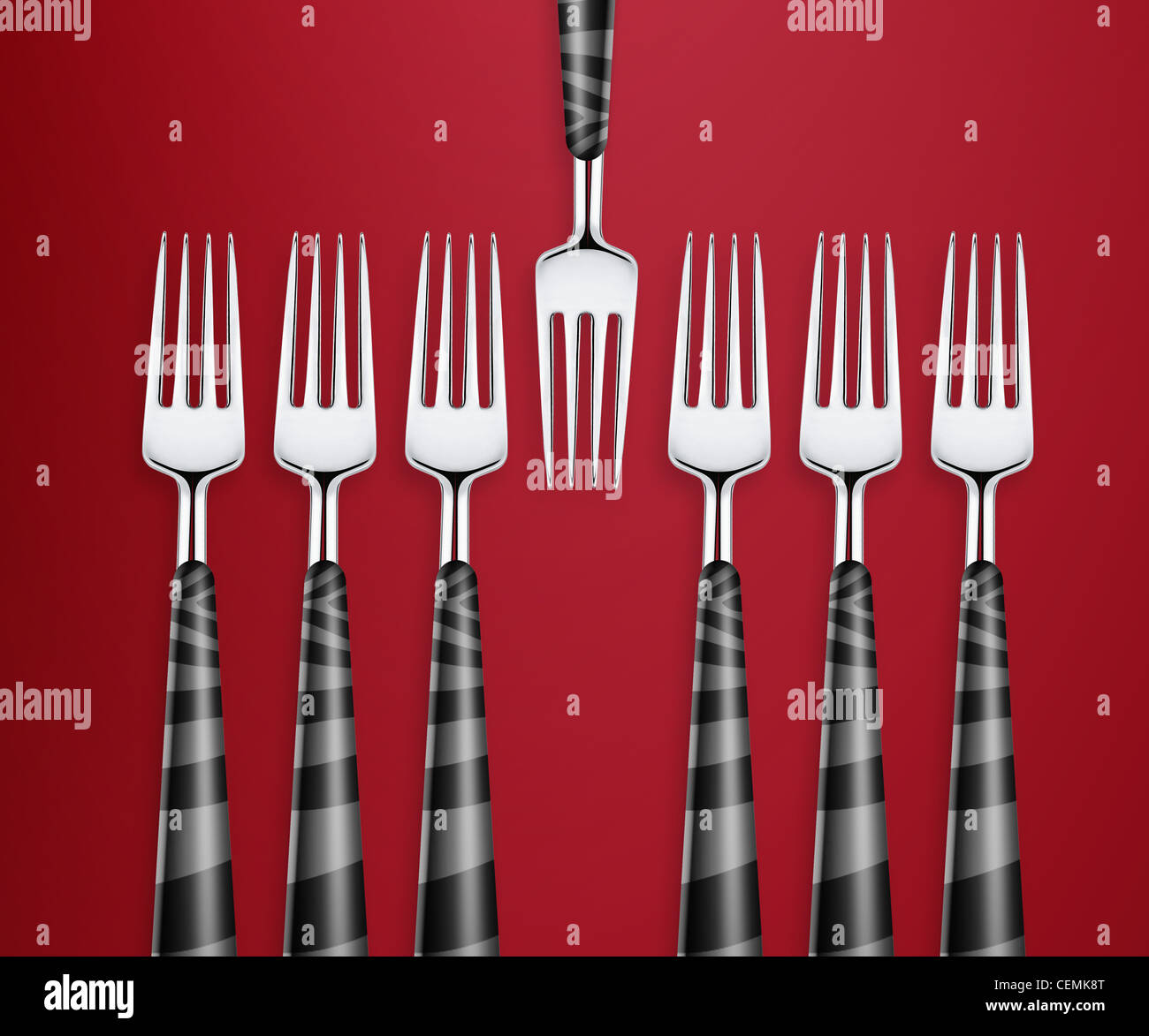 Set of forks on red background Stock Photo - Alamy