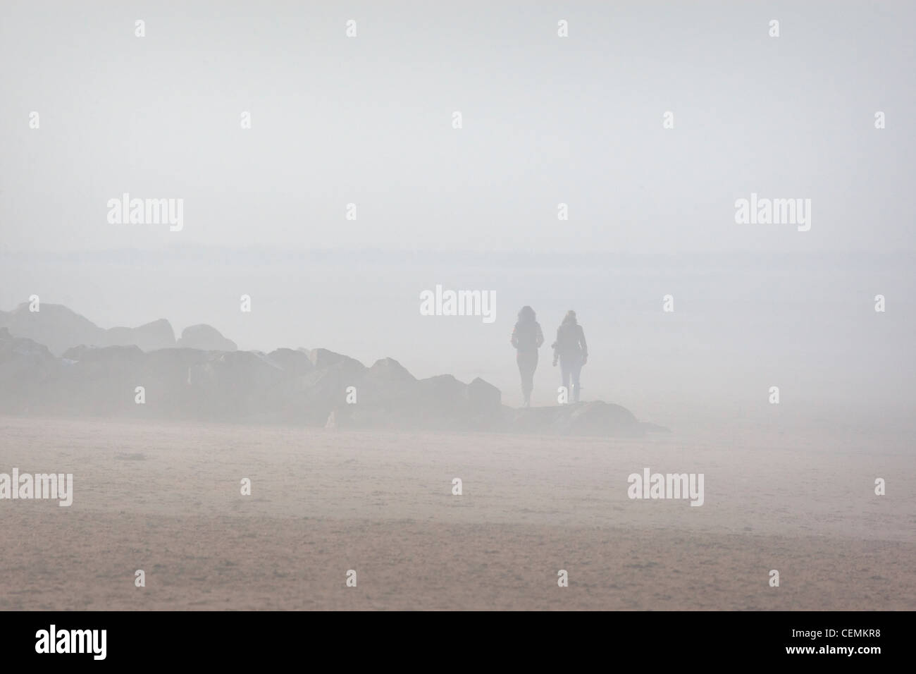 Walking in the mist on Norfolk coast Stock Photo - Alamy