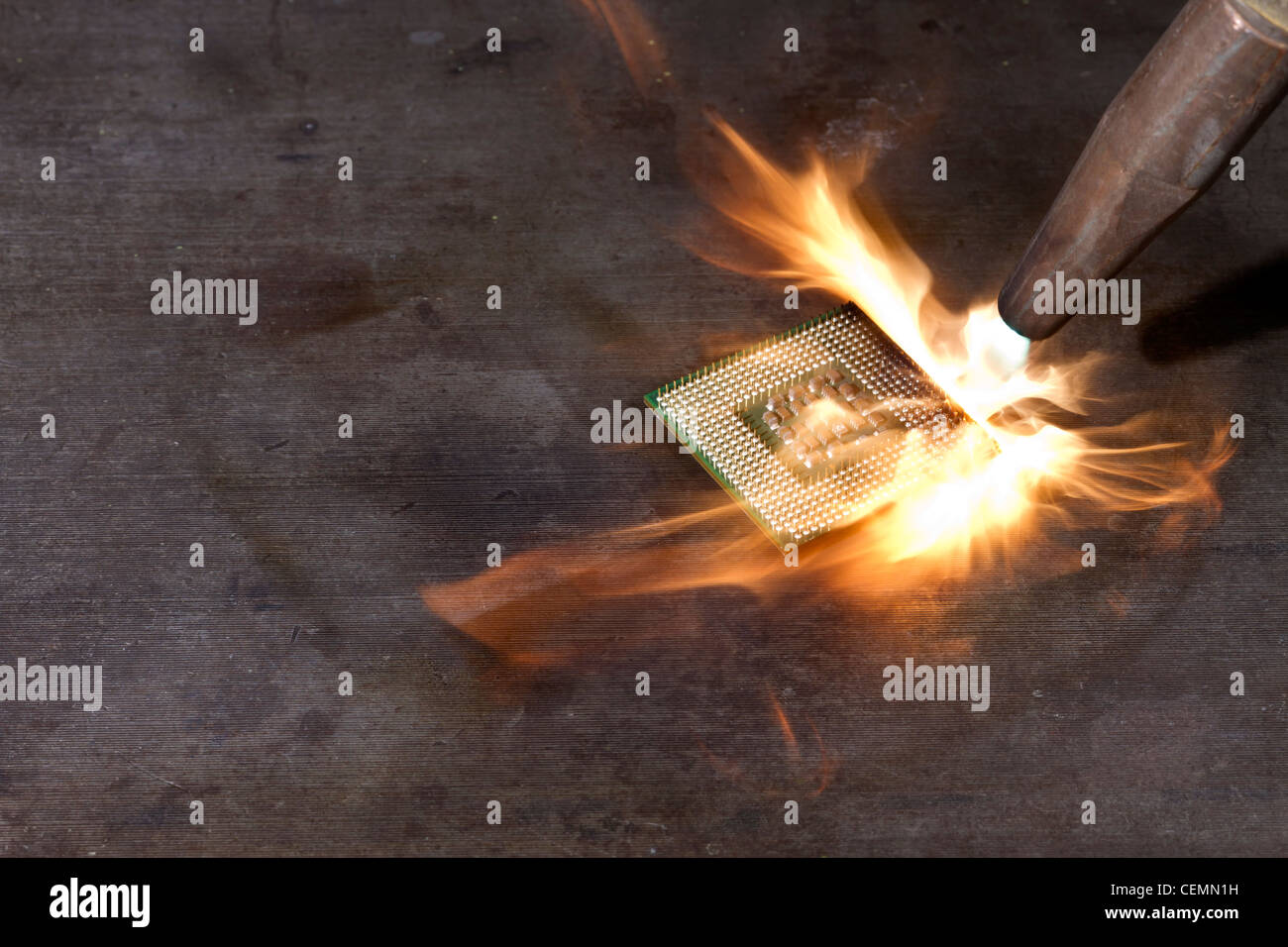 CPU and welding torch with big flame on metallic ground Stock Photo - Alamy