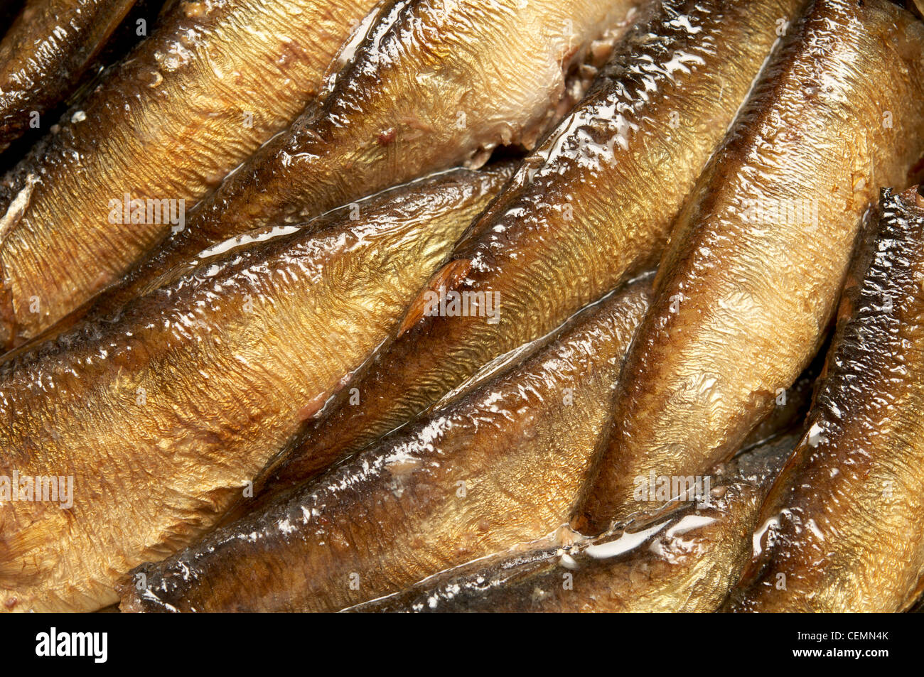 background of golden smoke sprat closeup Stock Photo - Alamy