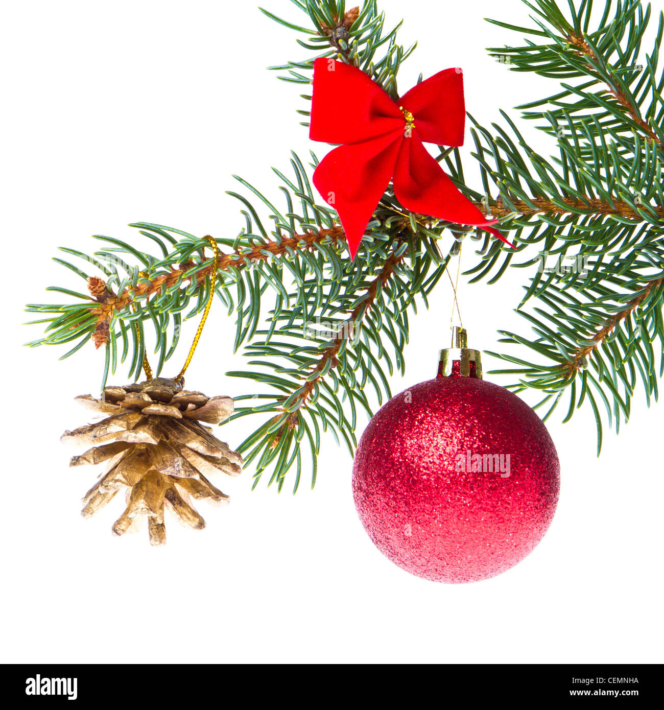 red christmas tree ball hanging from spruce isolated on white ...