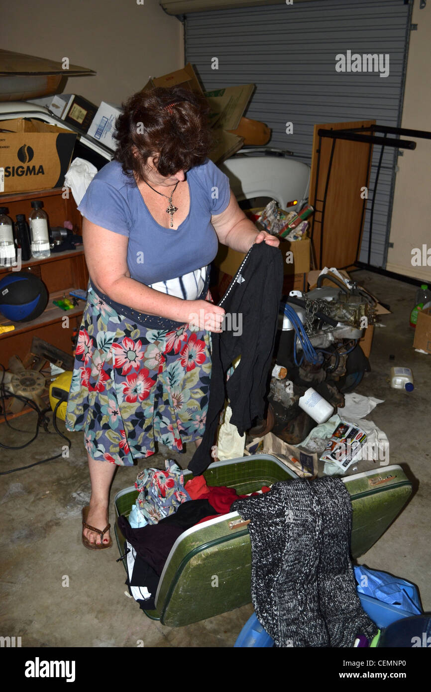 Sorting through old clothes hi-res stock photography and images - Alamy