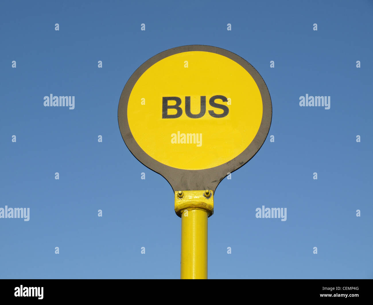 Yellow bus stop sign over blue sky background Stock Photo - Alamy