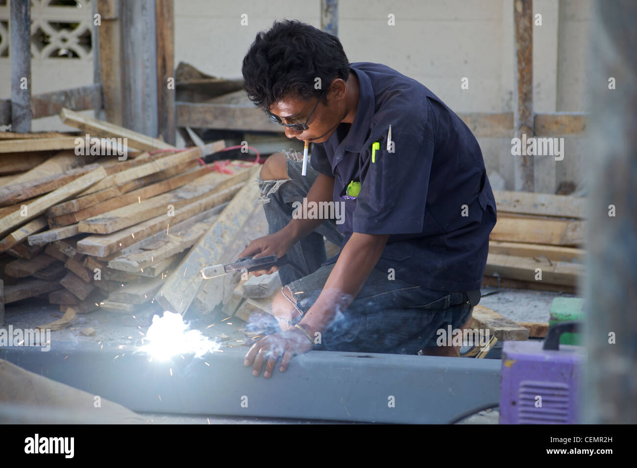 Thai workman arc welding, Phuket, Thailand Stock Photo - Alamy