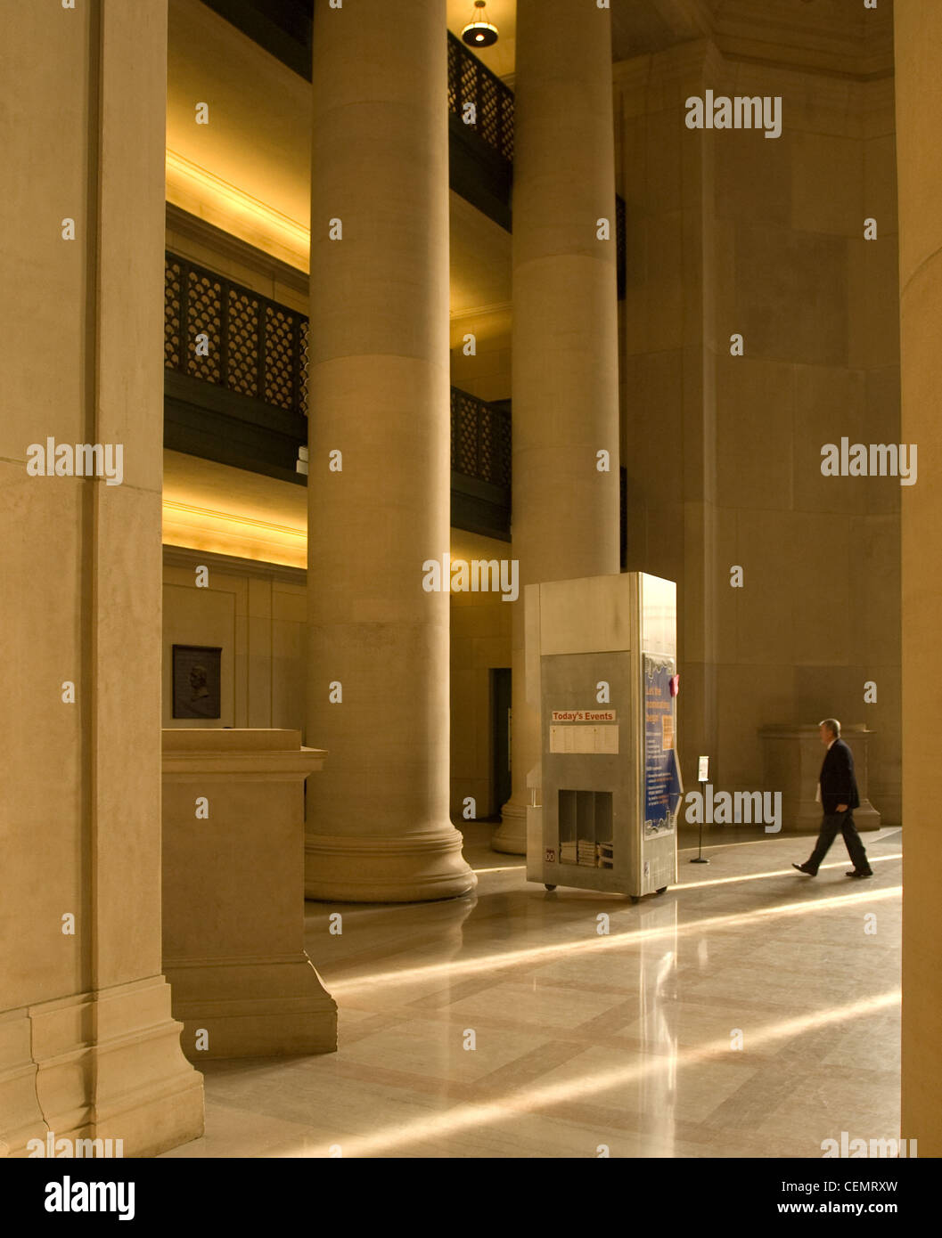 Passerby walk through shafts of light in MIT's Lobby 7 Stock Photo - Alamy