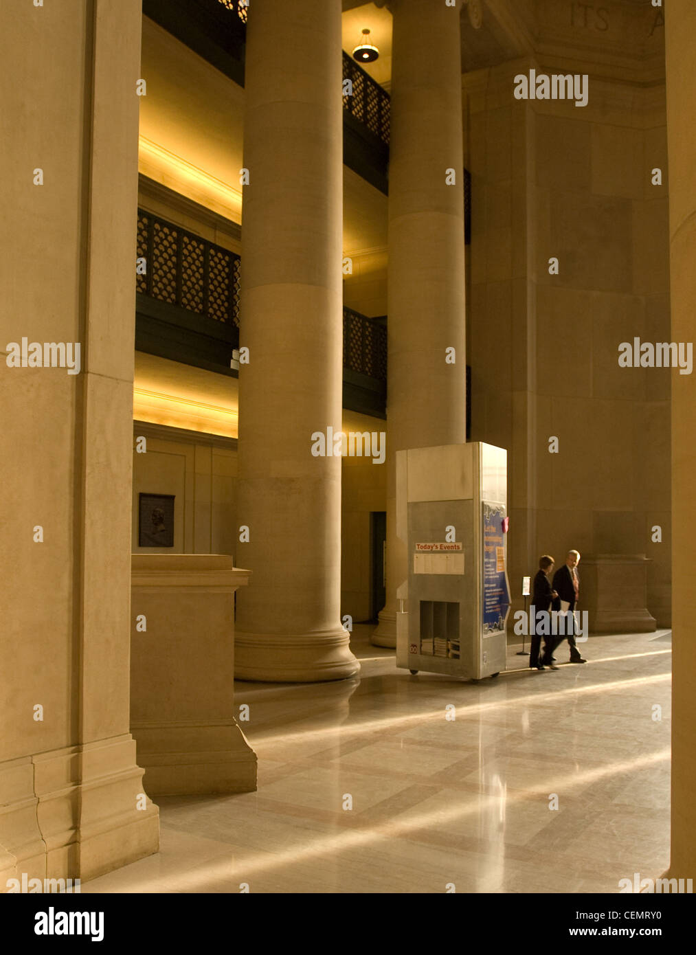 Passerby walk through shafts of light in MIT's Lobby 7 Stock Photo - Alamy