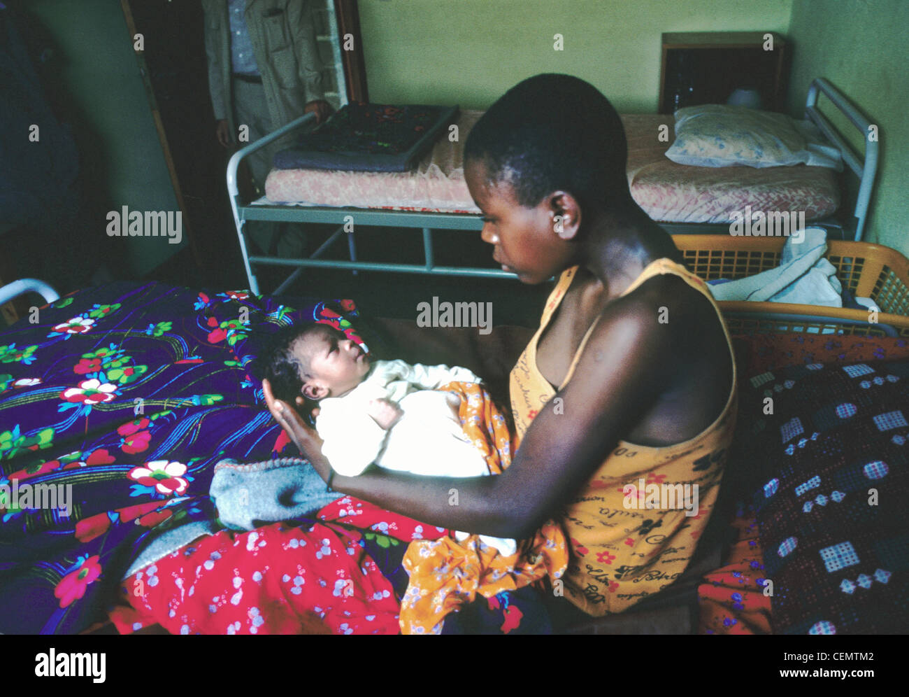 RWANDA : A young motrhe gazes fondly at her newborn baby Stock Photo ...