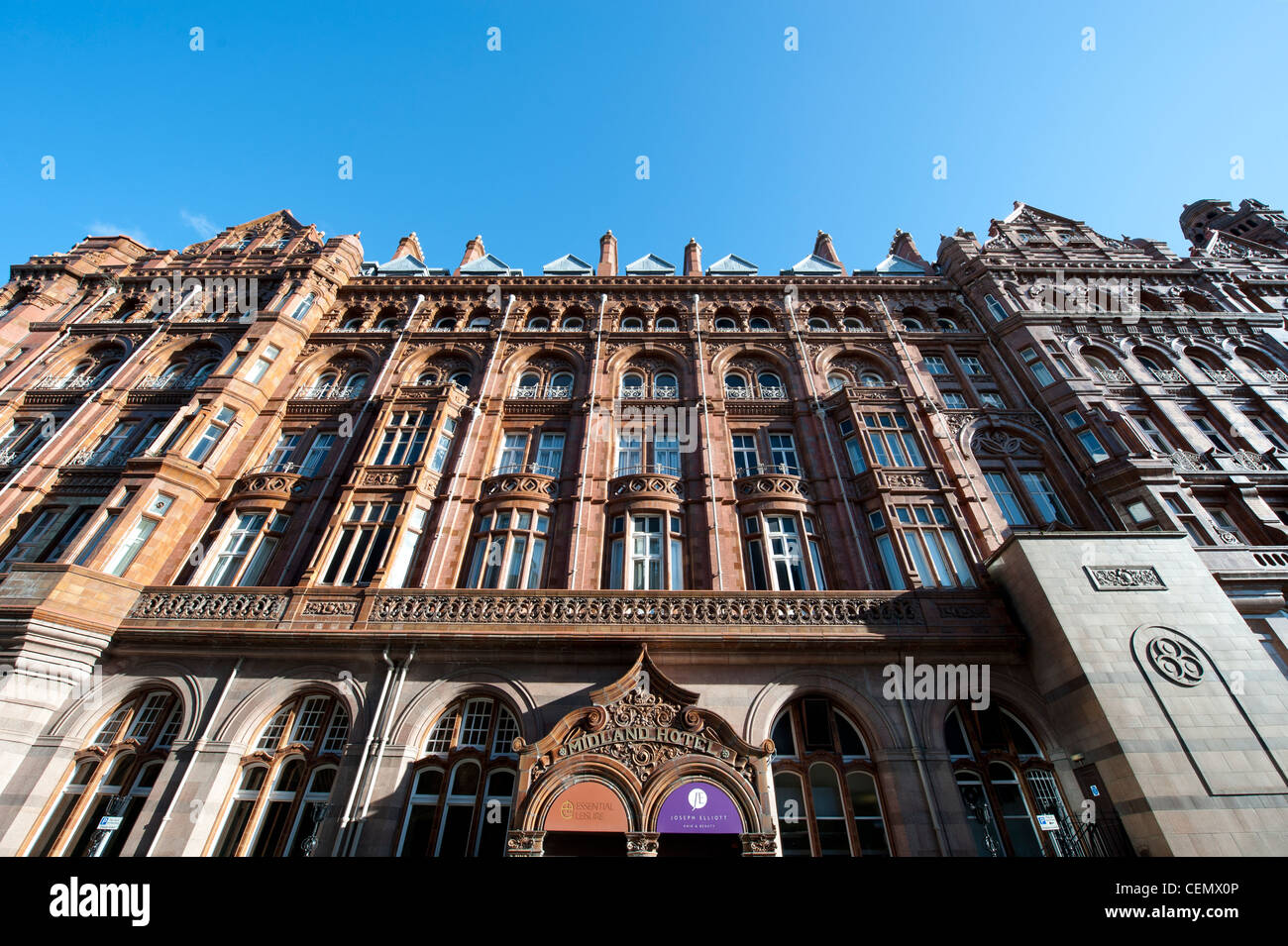 The Midland Hotel in Manchester City Centre on a clear blue sky day ...