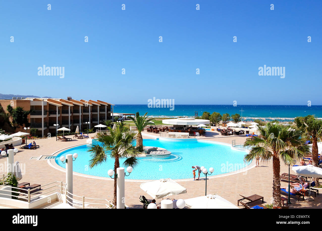 Swimming pool near beach at the modern luxury hotel, Crete, Greece ...