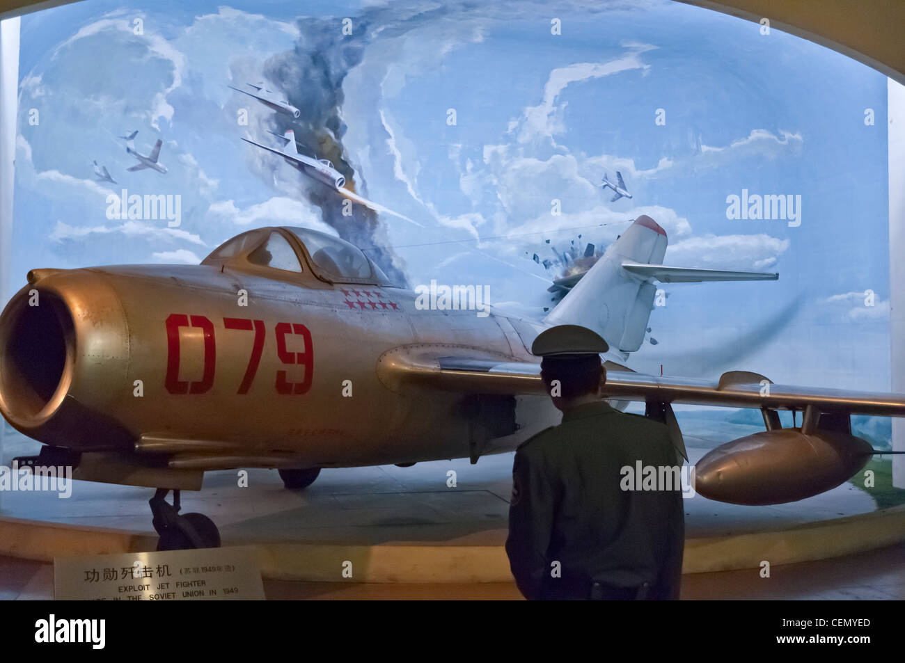 Military Museum in Beijing. Soldier watching at an old MIG jet ...