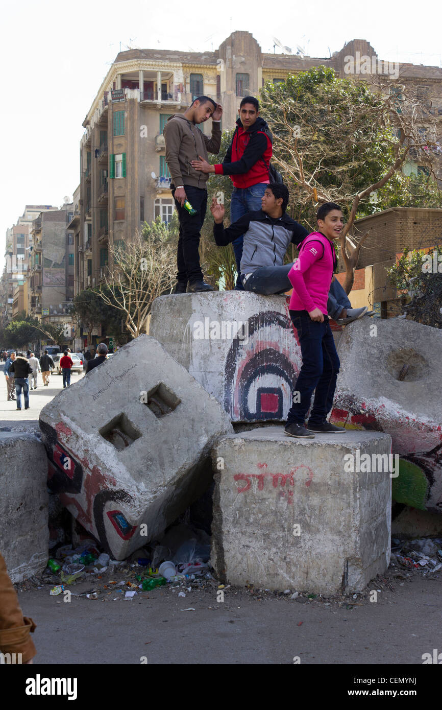youths posing on top of partially dismantled army barricade, Mohamed ...