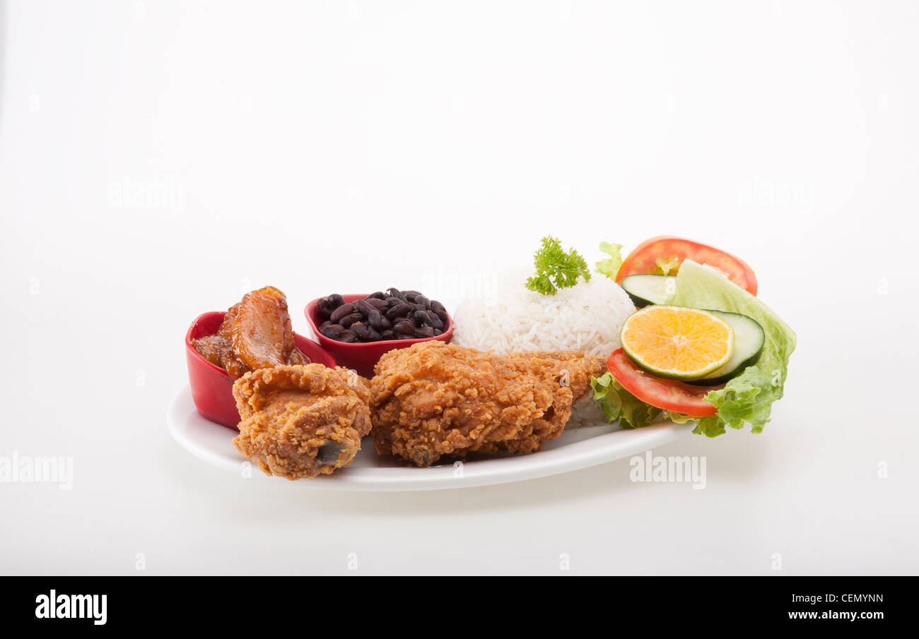 A plate of typical Costa Rican food at a restaurant or soda includes ...