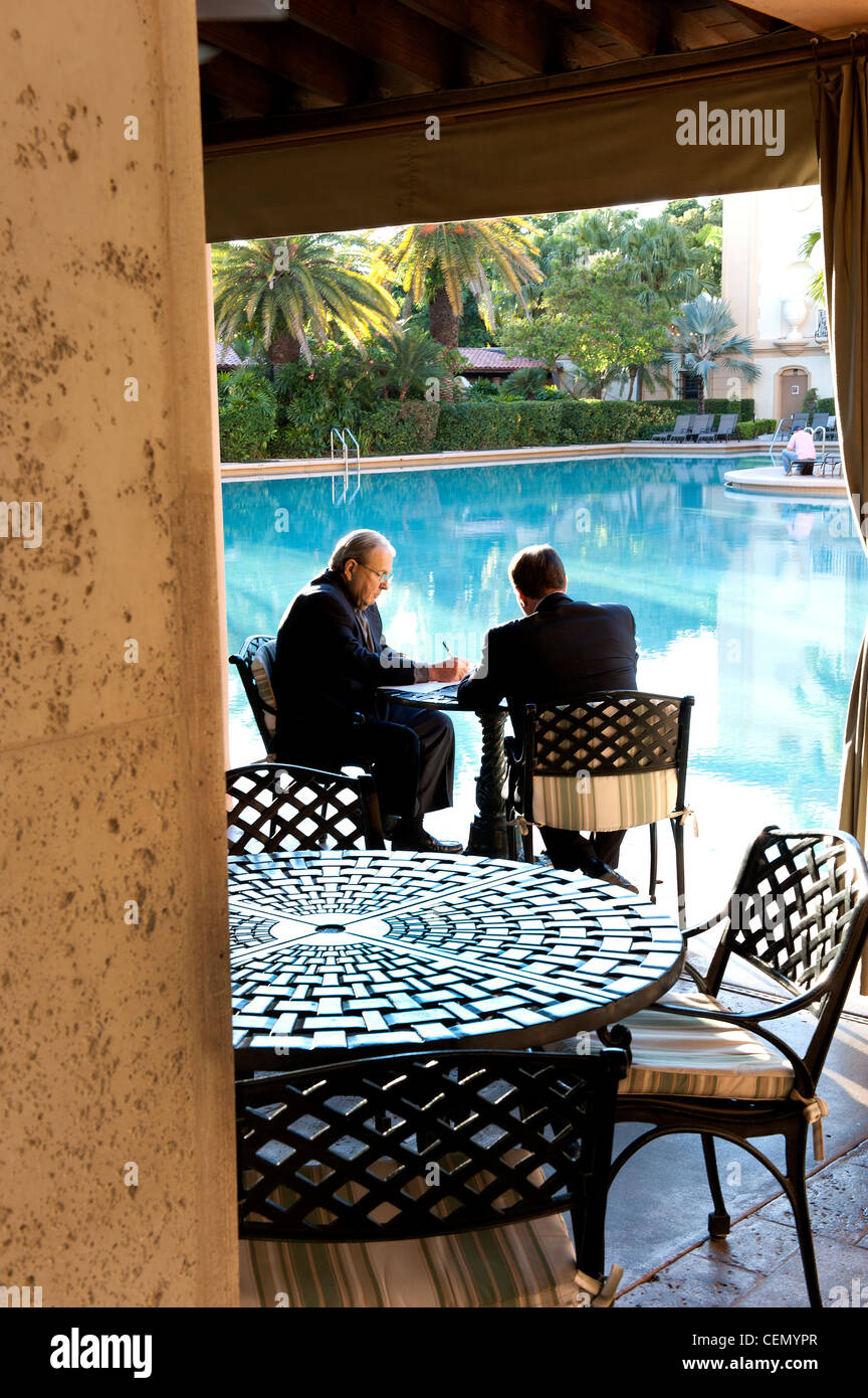 Business men at Poolside Meeting Stock Photo - Alamy