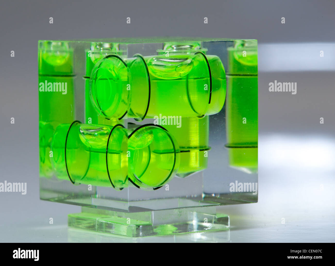 Three green spirit levels in plastic cube setting angle in any ...