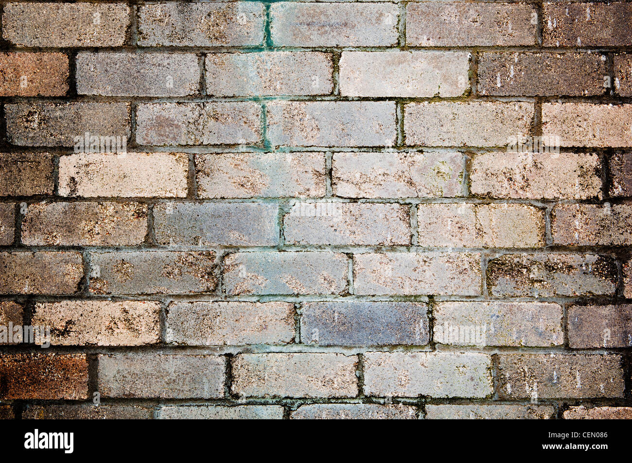 Brick wall with old worn bricks and stains Stock Photo - Alamy