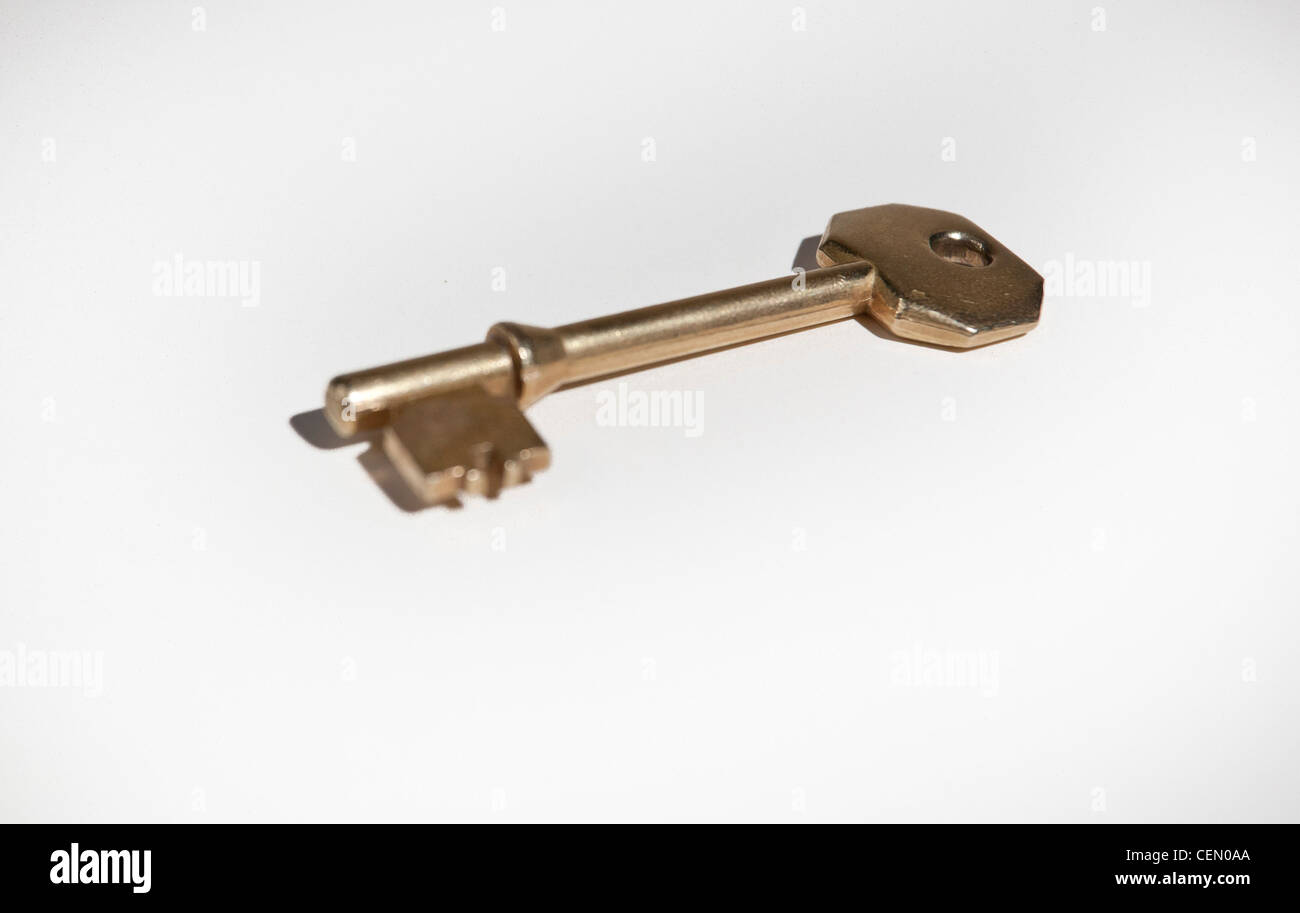 Isolated golden key Stock Photo - Alamy
