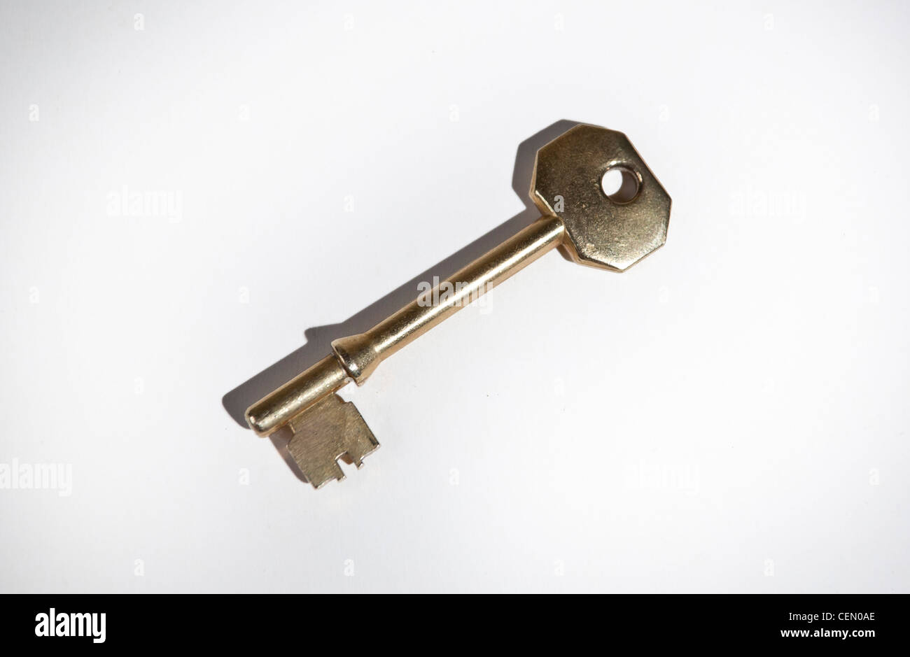 Isolated golden key Stock Photo - Alamy