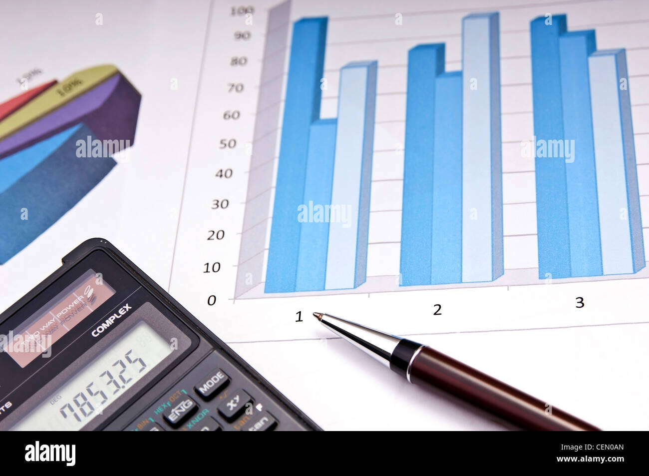 Graphs, calculator and paper statements for finance concept Stock Photo ...