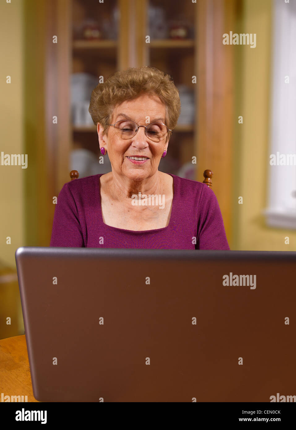 Senior woman and teenage girl using laptop hi-res stock photography and ...