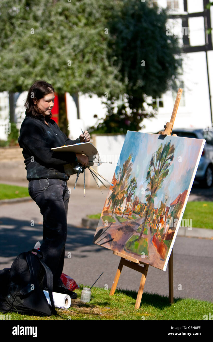 A female artist painting outdoors, Highgate, London, England, UK Stock ...