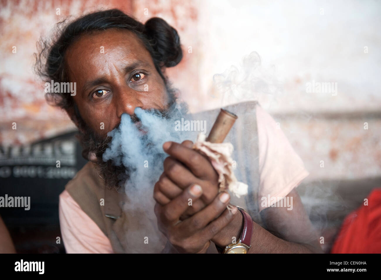 Portrait of a Sadhu smoking Shilum Stock Photo - Alamy