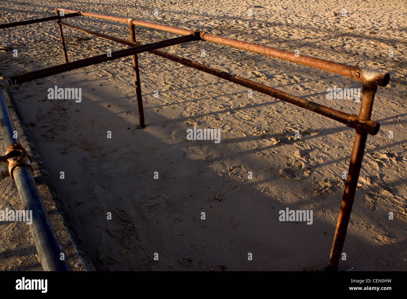 rusty metal bars on beach Stock Photo - Alamy