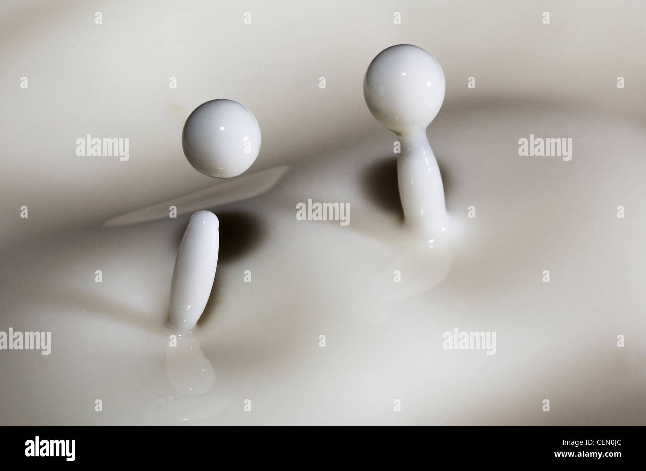Shapes created by drops of milk and milk splashes Stock Photo - Alamy