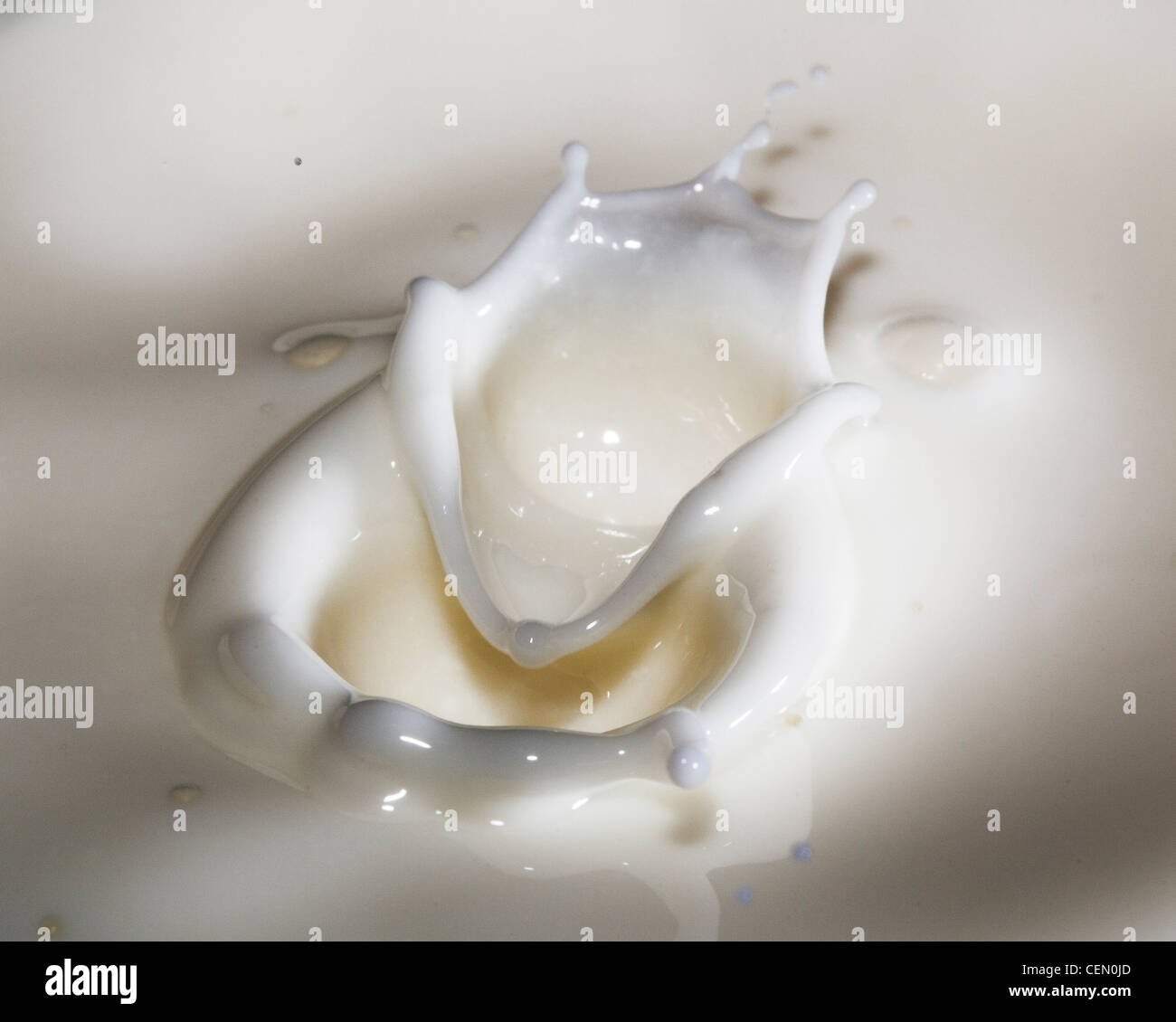 Shapes created by drops of milk and milk splashes Stock Photo - Alamy