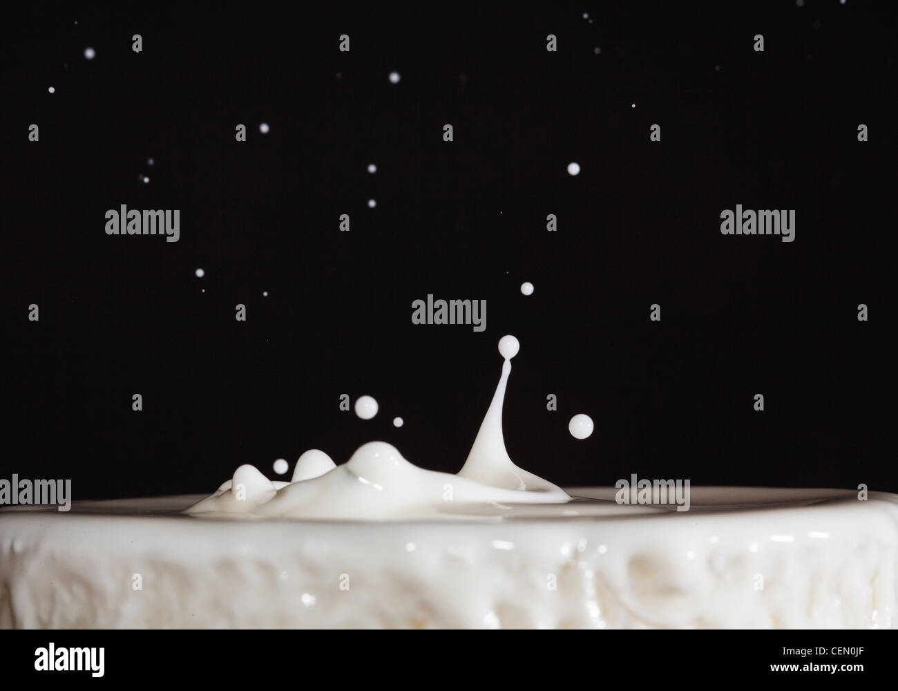 Shapes created by drops of milk and milk splashes Stock Photo - Alamy