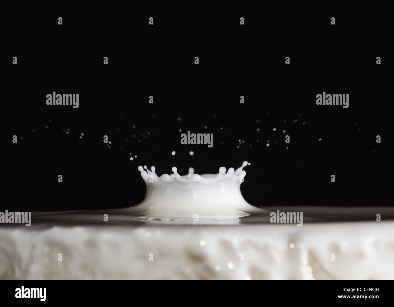 Shapes created by drops of milk and milk splashes Stock Photo - Alamy