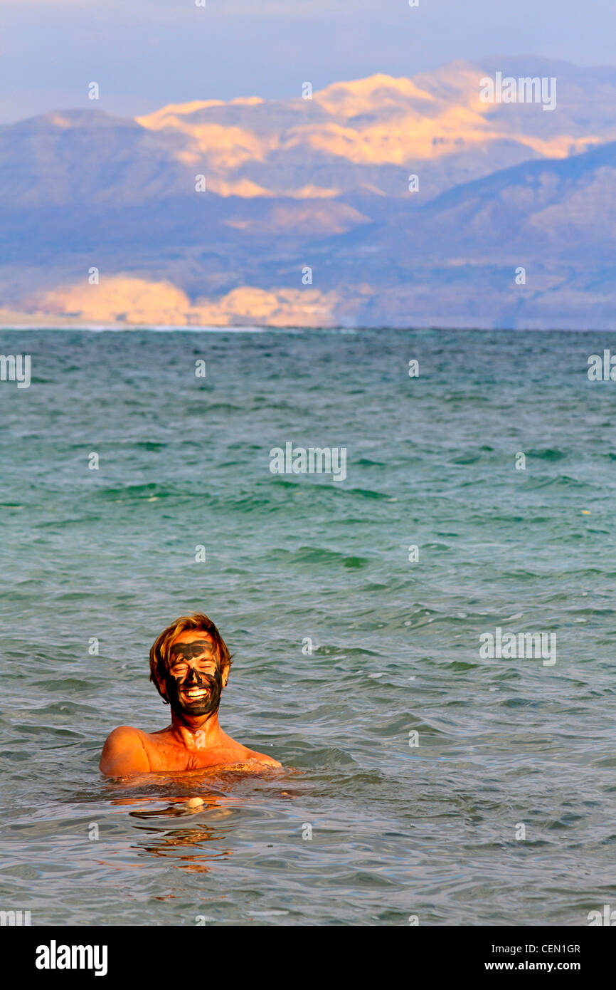 Bather floats in the super salty waters of the Dead Sea in Israel after ...