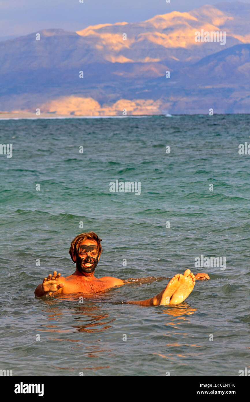 Bather floats in the super salty waters of the Dead Sea in Israel after ...