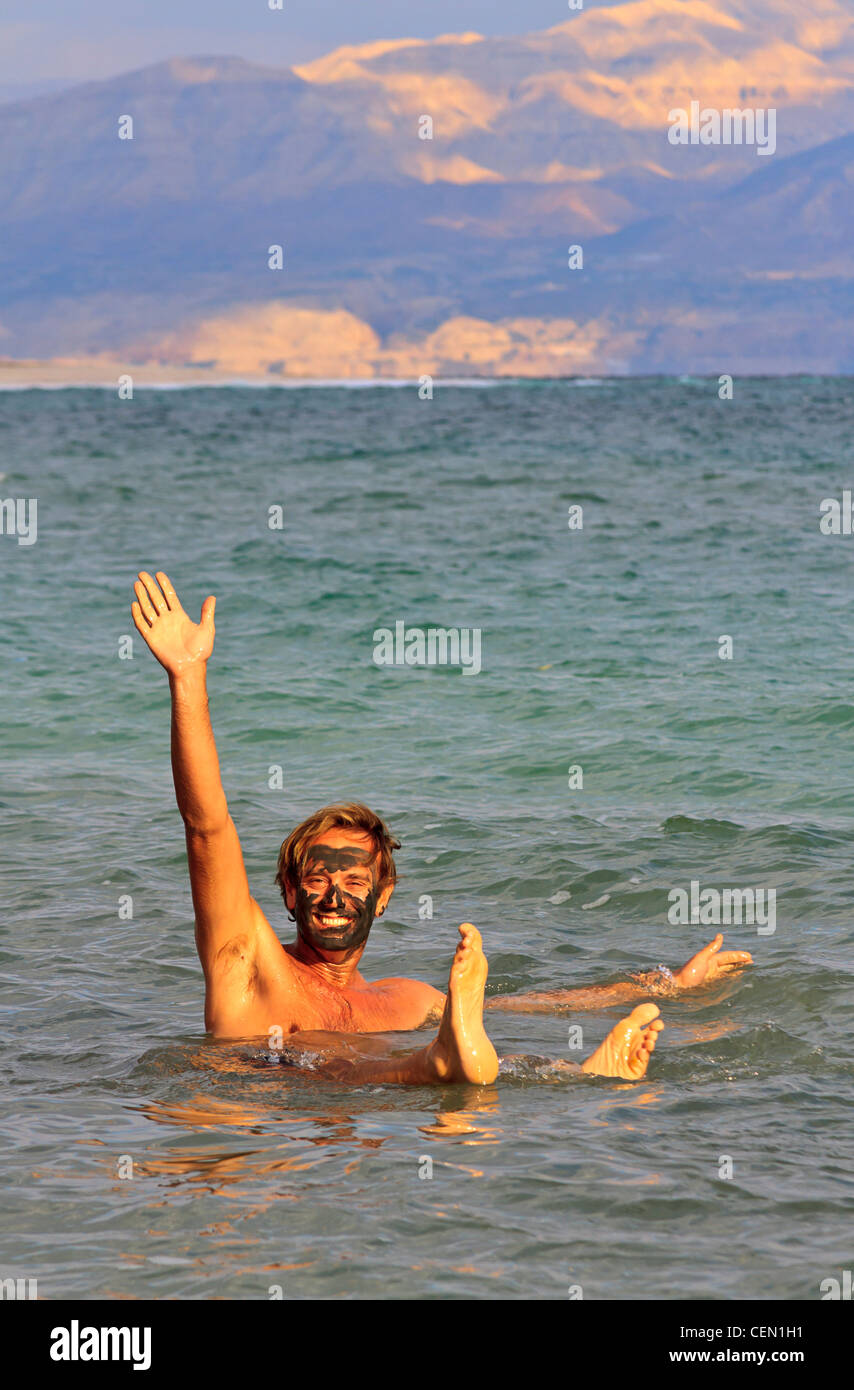 Bather floats in the super salty waters of the Dead Sea in Israel after ...
