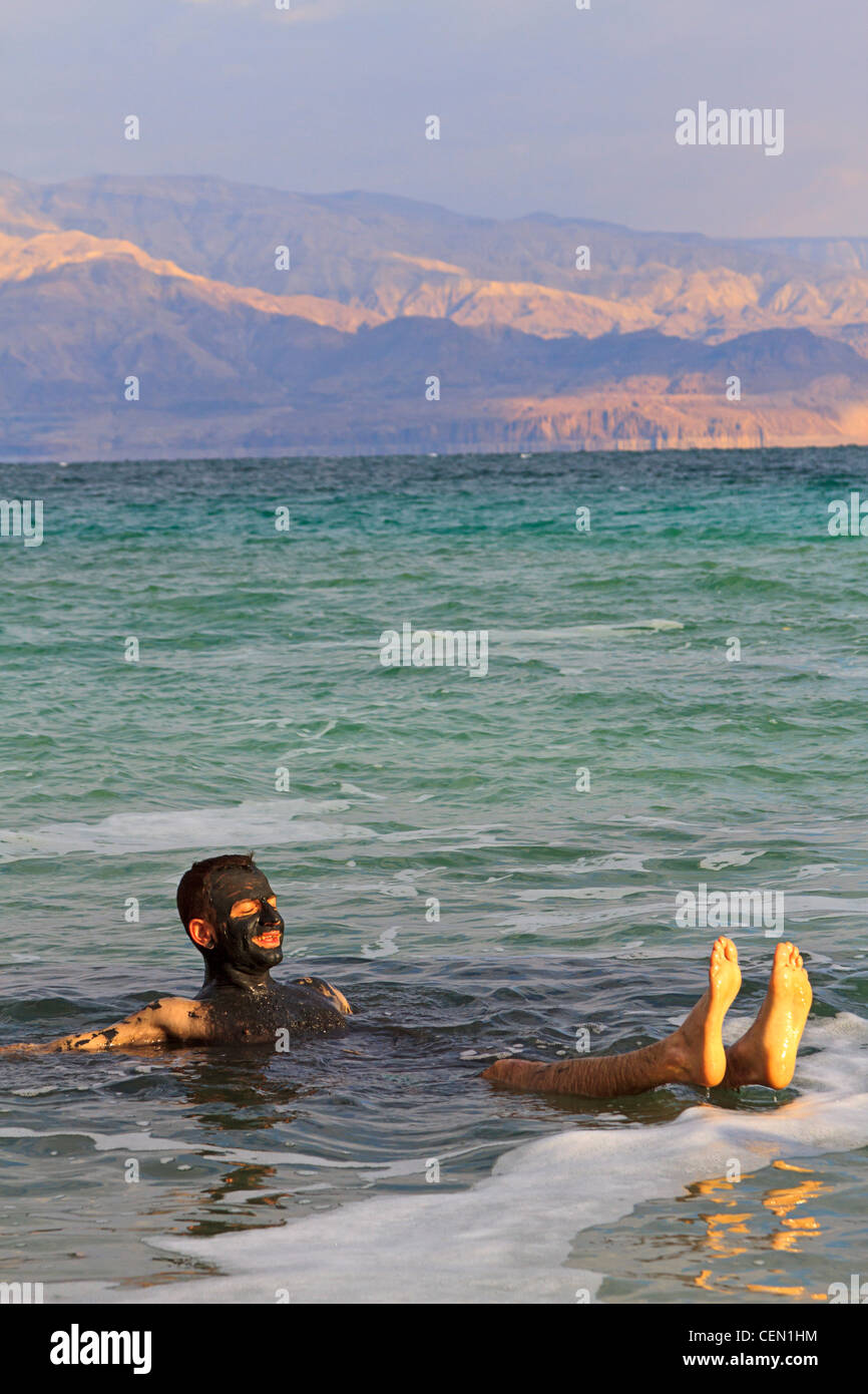 Bather floats in the super salty waters of the Dead Sea in Israel after ...