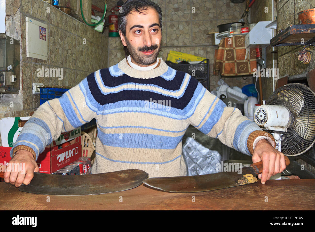 Arab man shows off his kebab knives which are 280 years old. He owns a ...