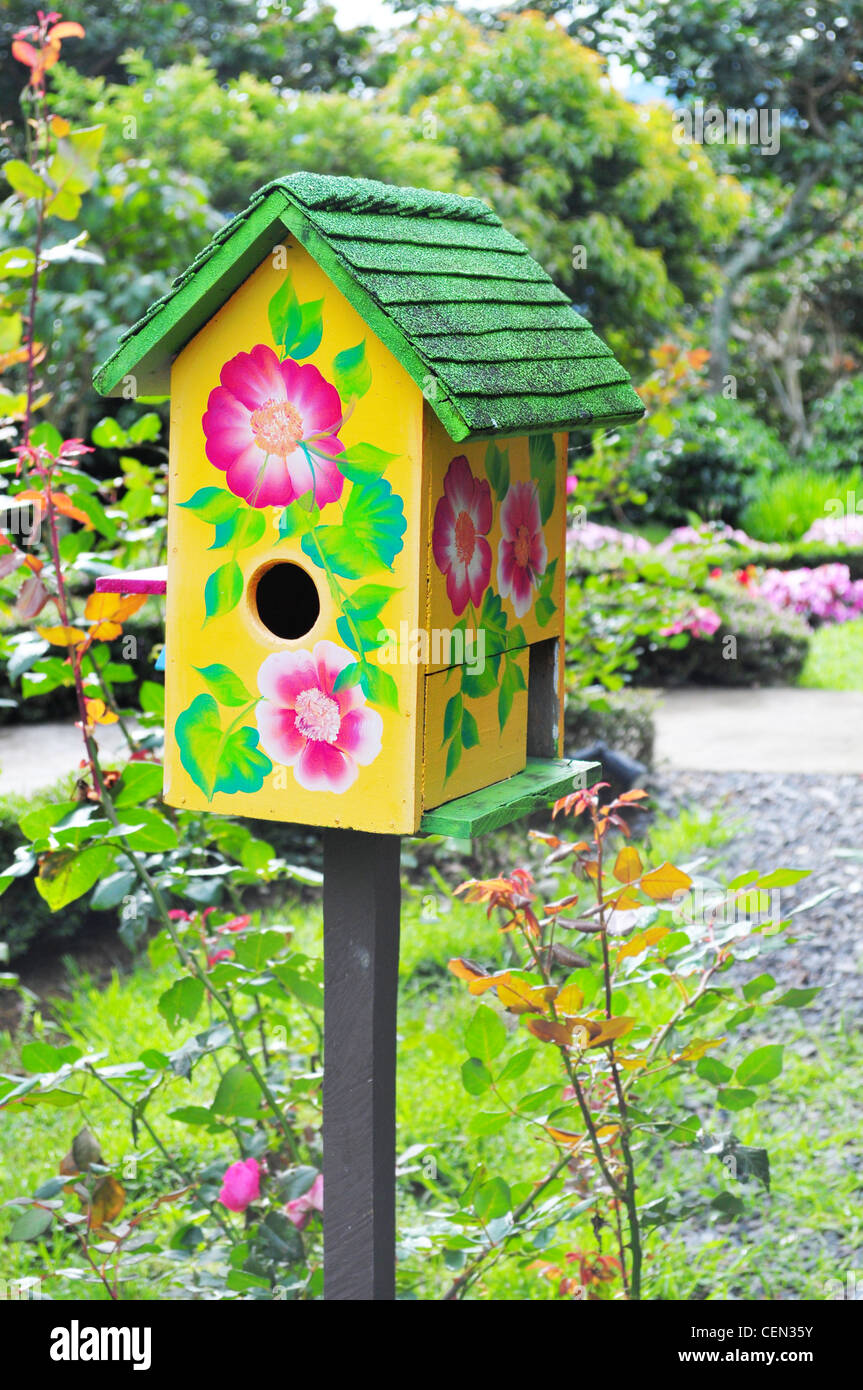 Beautiful bird house in a lush garden Stock Photo - Alamy