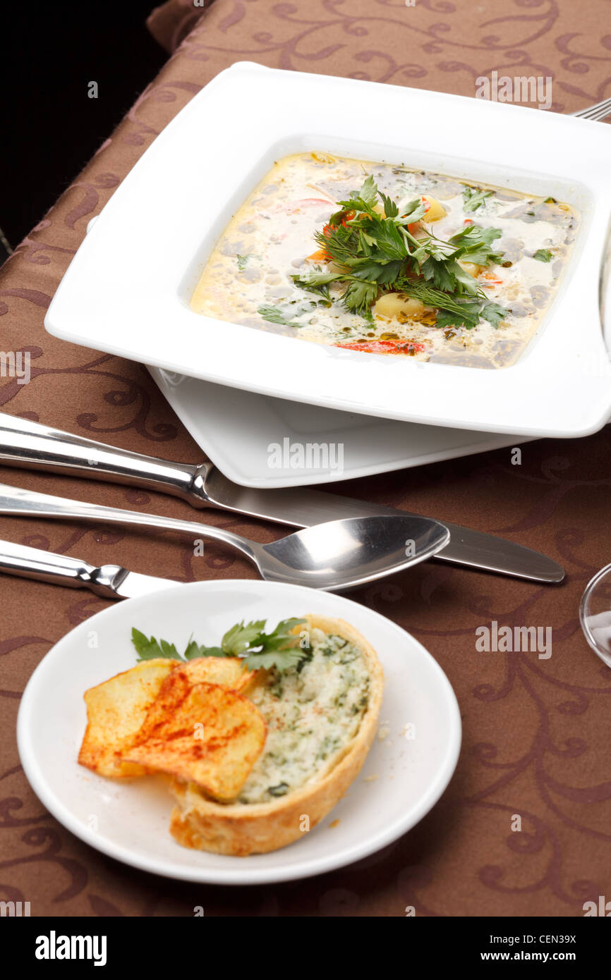 fish soup with potato chips and fish pie Stock Photo - Alamy